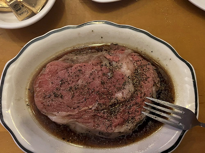 This is the kind of prime rib that makes vegetarians question their life choices—perfectly pink and unapologetically generous.
