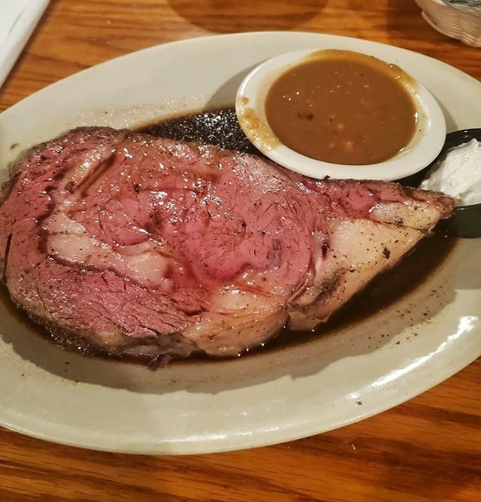 The prime rib arrives like a carnivore's dream – perfectly pink, accompanied by that magical au jus that's practically drinkable on its own.