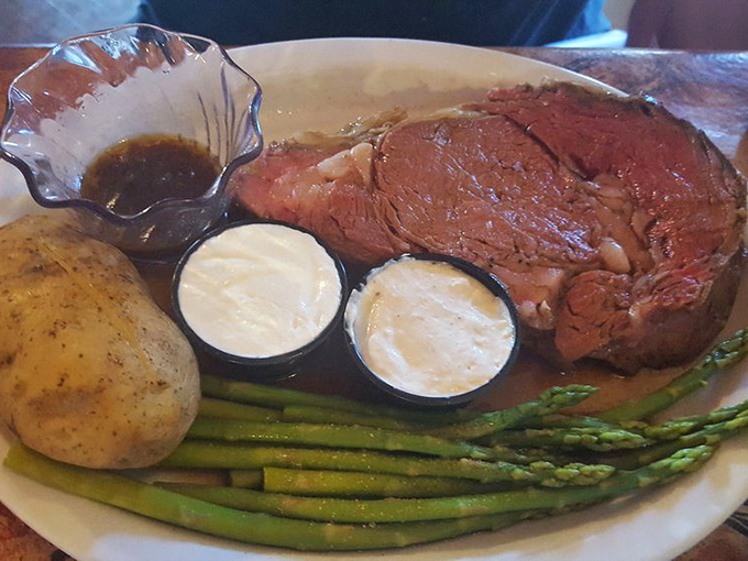 This prime rib arrives looking like it dressed up for the occasion, complete with asparagus and potato companions.