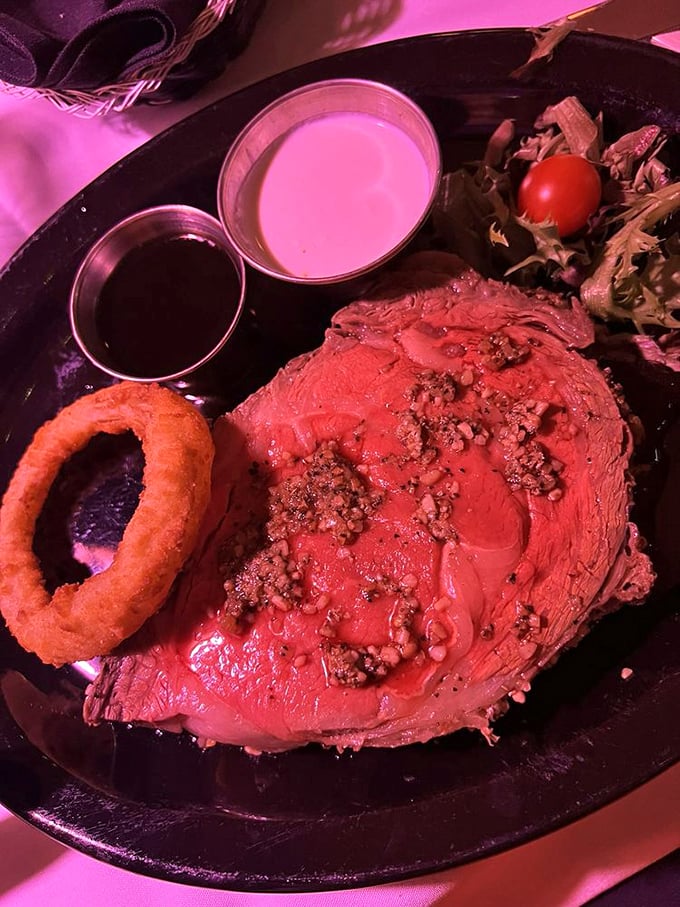 This prime rib isn't just dinner—it's a religious experience with au jus baptism. The onion ring is just showing off at this point.