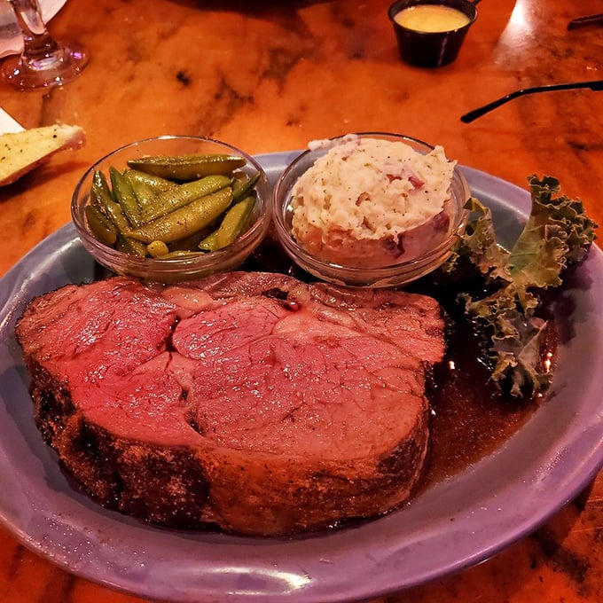 This isn't just prime rib; it's a carnivore's sonnet—perfectly pink, fork-tender, and accompanied by sides that know their supporting role.