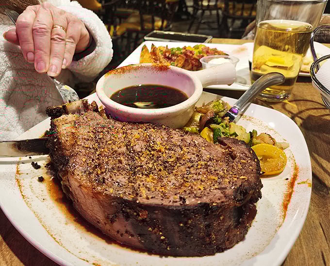 Behold the star attraction—a perfectly seasoned prime rib with a seasoned crust that would make even vegetarians reconsider their life choices.
