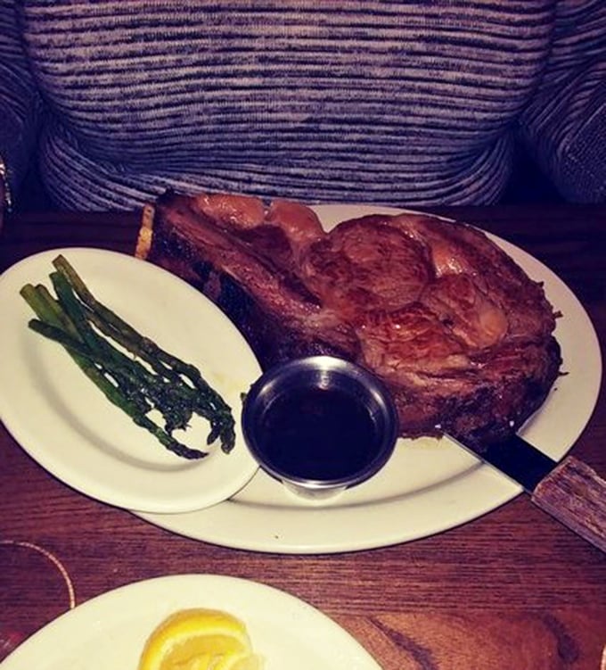 This prime rib isn't just dinner—it's an event. Served with asparagus and au jus, it's the kind of meal that makes vegetarians question their life choices.