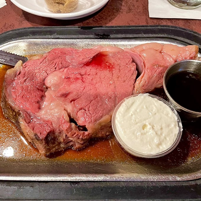 Behold the star attraction: prime rib so perfectly pink it should have its own Instagram account. That jus cup isn't just a condiment—it's liquid gold.