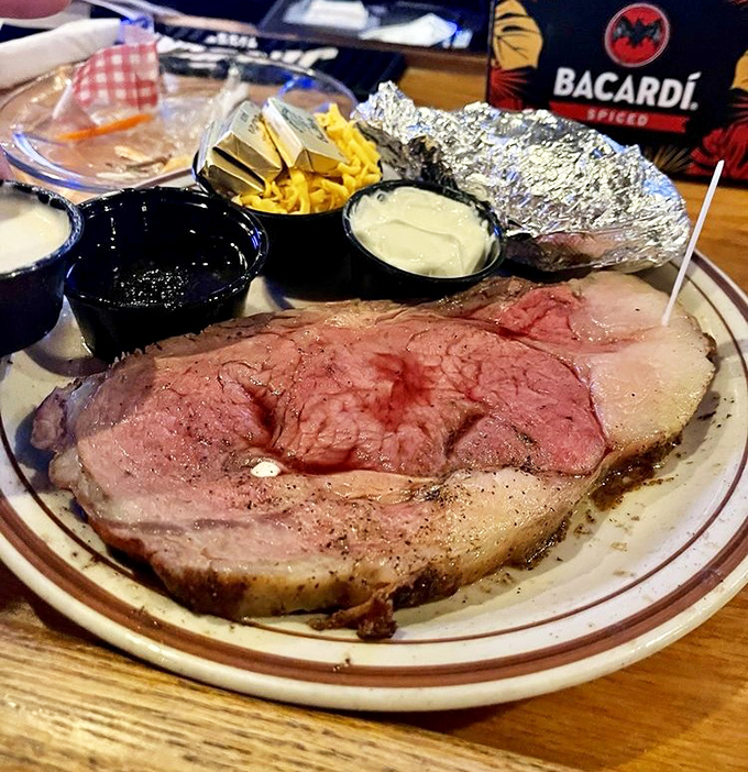 That prime rib arrives looking like it graduated magna cum laude from Beef University.