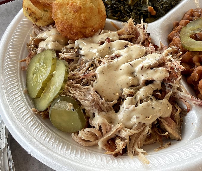This isn't just pulled pork – it's a masterclass in smoke and patience, served with pickles that provide the perfect tangy counterpoint.