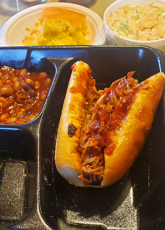 This pulled pork sandwich could make a vegetarian question their life choices – gloriously messy and absolutely worth it.