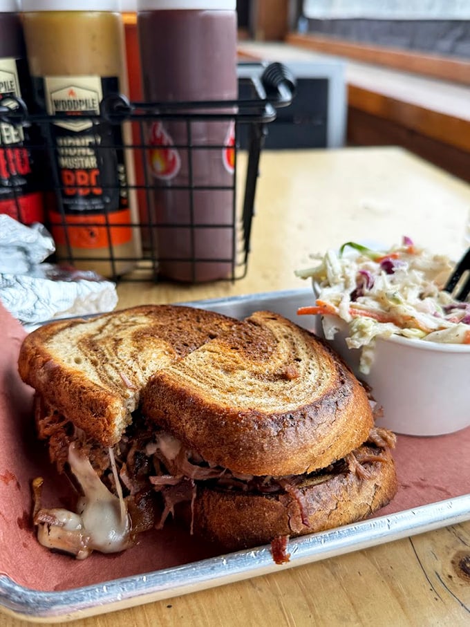 Not just a sandwich, but a work of art. The marbled rye cradles pulled pork like it was born for this purpose, with coleslaw standing by.