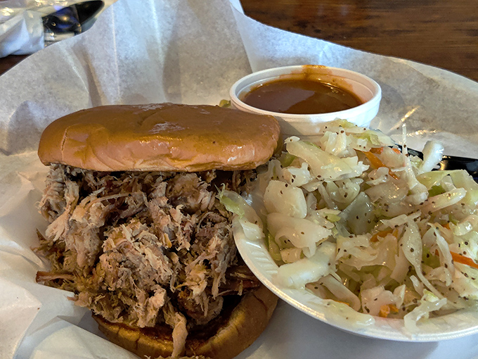 This pulled pork sandwich isn't just food, it's architecture – a carefully constructed monument to smoke, time, and Georgia know-how.