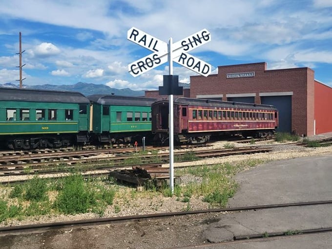 Classic Americana at its finest—where railroad crossing signs stand sentinel over tracks that have witnessed decades of comings and goings.