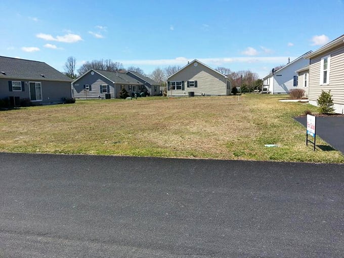 An empty lot means possibility—like a blank canvas waiting for your retirement dreams to take architectural form.