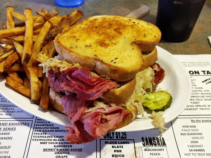 The legendary Reuben in all its glory – towering corned beef, tangy sauerkraut, and melted Swiss on perfectly grilled rye. Worth every napkin you'll need.