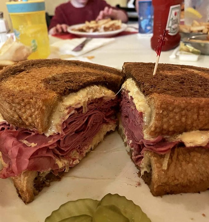Behold the crown jewel: Emil's Reuben in all its glory. That perfect stack of corned beef isn't just a sandwich—it's architecture with flavor.
