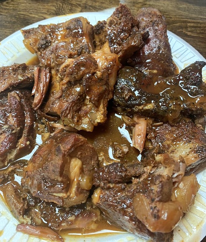 These rib tips aren't just food—they're a glistening, sauce-lacquered testament to Memphis' barbecue mastery. Napkins required, regrets impossible.