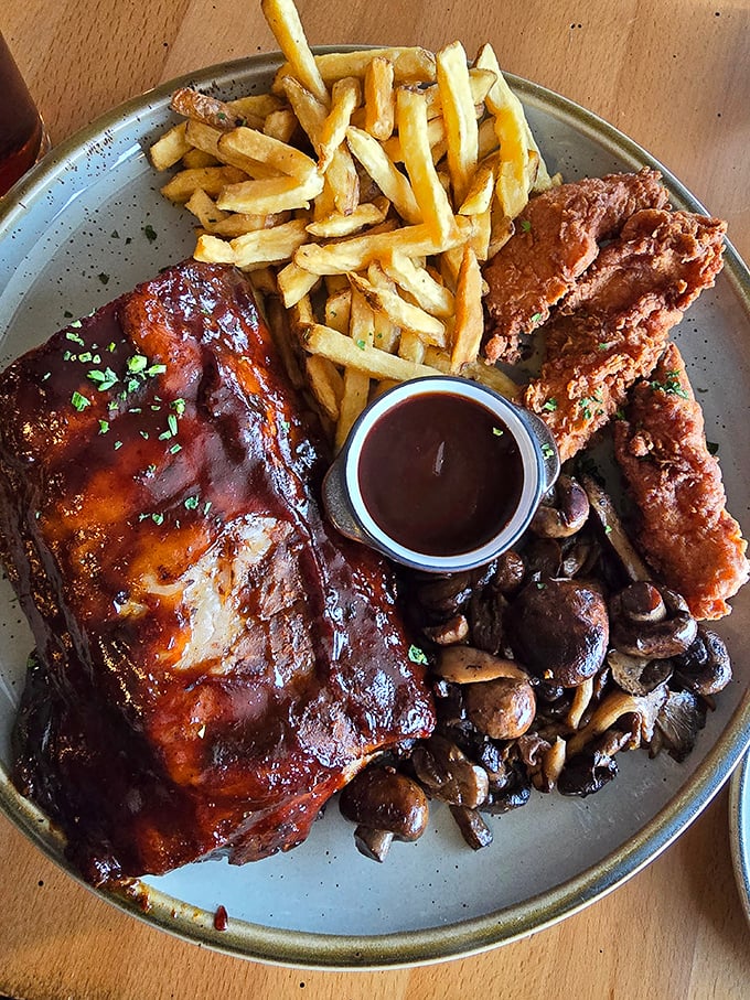 Behold, the star attraction! These ribs don't just fall off the bone—they practically leap onto your fork in a glorious act of barbecue surrender.