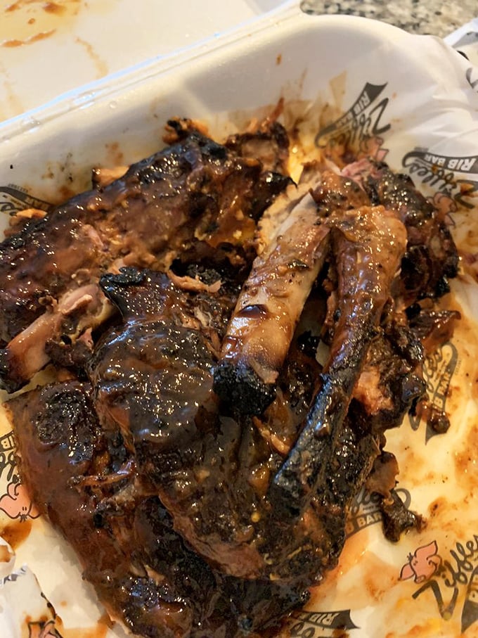 Fall-off-the-bone isn't just an expression here—it's a scientific certainty. These ribs have clearly been introduced to heat and smoke with expert precision.