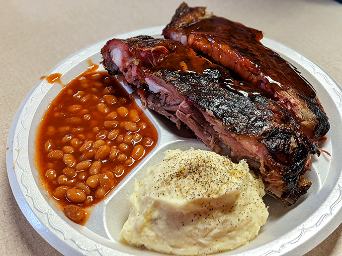 That smoke ring doesn't lie—these ribs have spent quality time becoming the tender masterpieces they were meant to be.