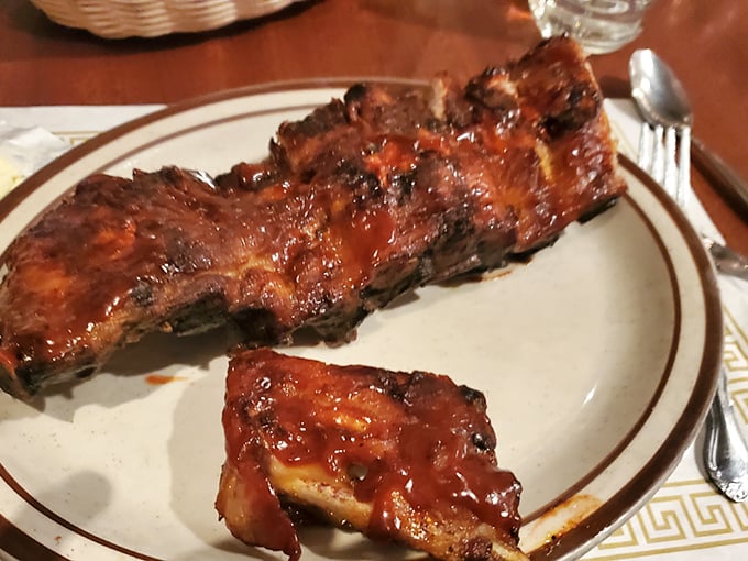 These ribs don't just fall off the bone—they practically leap into your mouth, glistening with that signature sauce that walks the perfect sweet-tangy tightrope.