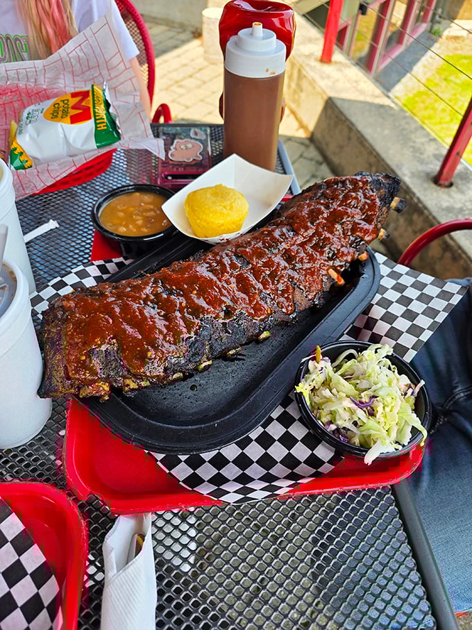 Not so much falling off the bone as clinging to it with dignity – these ribs have the perfect bark, smoke ring, and sauce-to-meat ratio.