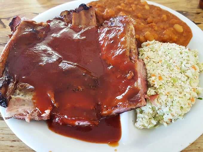 These ribs don't need a fancy introduction—they speak the universal language of perfectly smoked meat, tangy sauce, and sides that refuse to be upstaged.