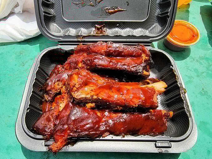Glistening with a perfect lacquer of smoke and sauce, these ribs aren't just food—they're edible evidence that patience is the secret ingredient in greatness.