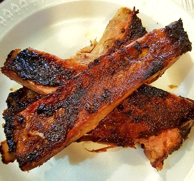 These ribs don't just fall off the bone—they practically leap toward your mouth. That bark is the result of patience, not shortcuts.