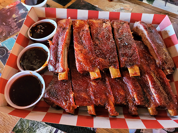 These ribs aren't just falling off the bone—they're practically volunteering to jump onto your plate, glistening with a perfect lacquer of sauce and spice.