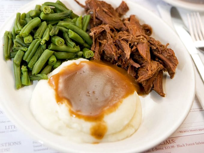 This isn't just roast beef—it's a tender, slow-cooked masterpiece with mashed potatoes that could make a grown man weep. Comfort on a plate.