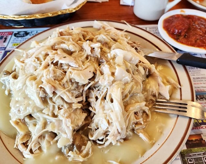 This pulled turkey mountain isn't just a meal—it's an engineering marvel of tender meat and creamy potatoes that would make NASA scientists proud.