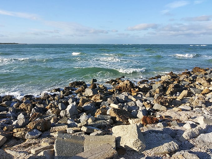 Nature's breakwater—these rocky shores provide perfect perches for fishermen and contemplative moments away from the crowds.