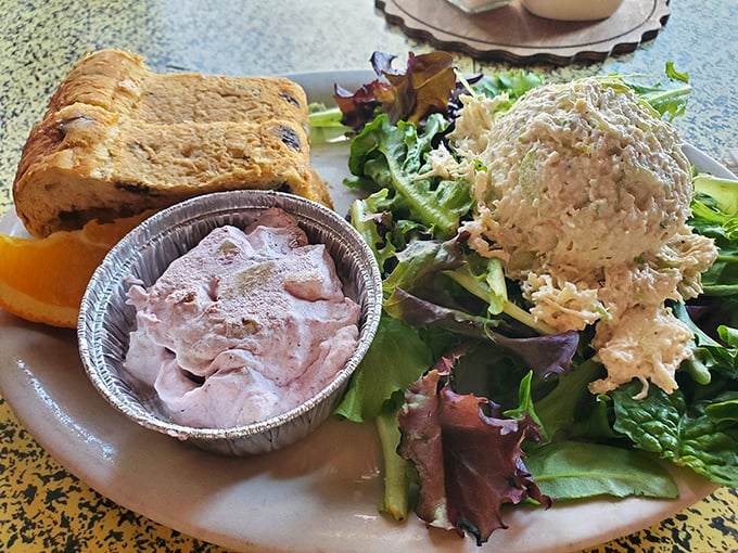 Chicken salad that doesn't just sit on the plate—it performs. Paired with fresh greens and that signature cinnamon raisin bread, it's a symphony of flavors.