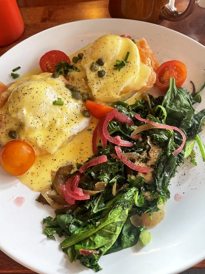 Behold the legendary Smoked Salmon Benedict—where Norwegian salmon, pickled onions, and capers perform a synchronized swimming routine in hollandaise.