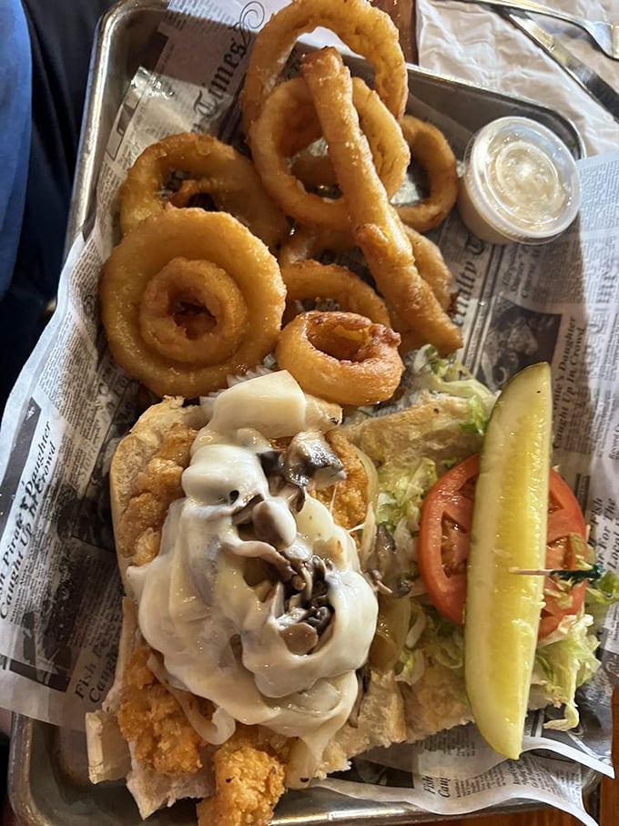 The star of the show: Hogfish sandwich with golden onion rings. This isn't just lunch; it's the reason people drive across islands to Stock Island.