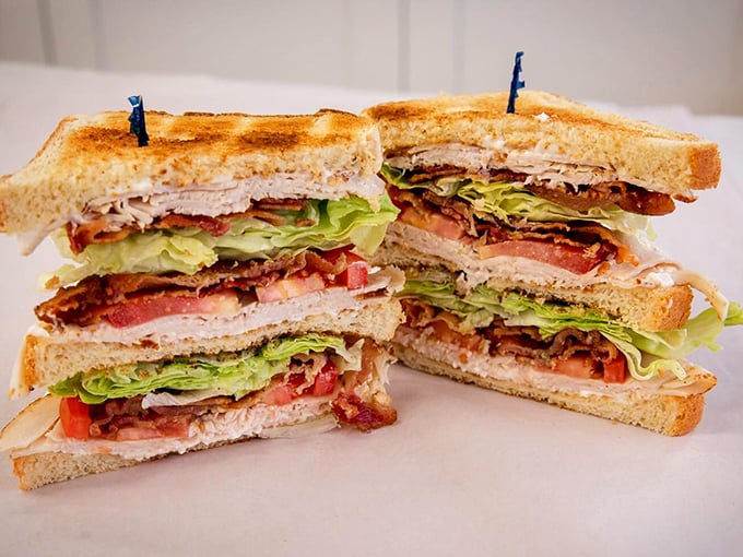 Layer upon layer of perfectly stacked ingredients – this isn't just a sandwich, it's architecture you can eat.