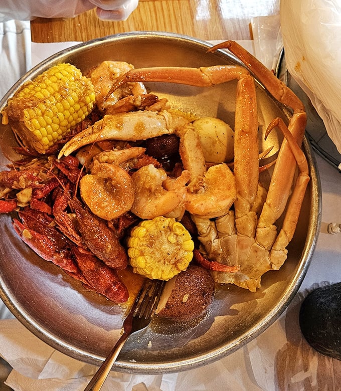 Not so much a meal as a treasure hunt—snow crab legs, crawfish, shrimp, and corn on the cob swimming in seasoned butter glory.