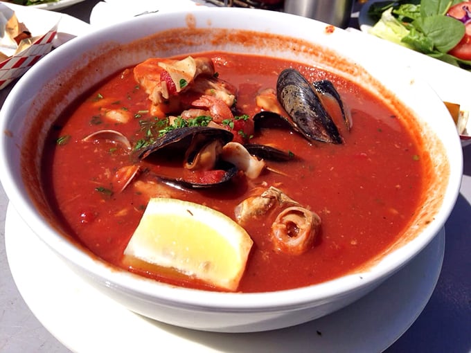 Behold the legendary cioppino – a tomato-based symphony where shellfish and fish perform in perfect harmony. This isn't soup; it's liquid poetry.