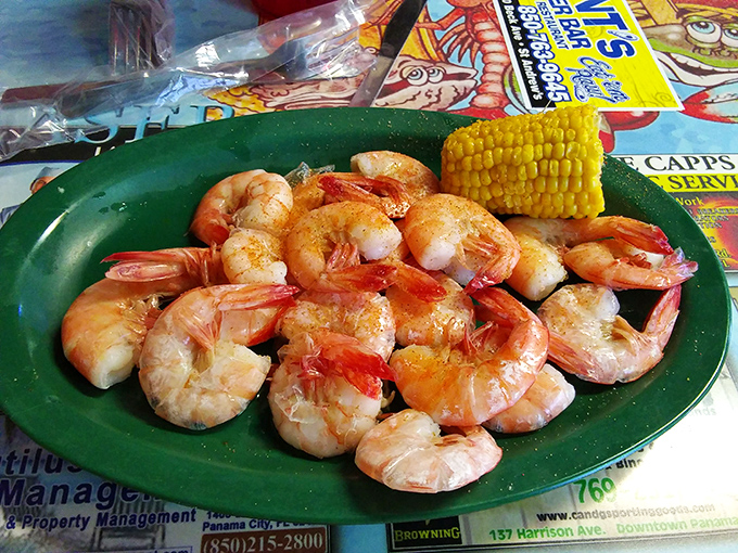 These aren't just shrimp – they're plump Gulf ambassadors that have sacrificed themselves for your happiness, served with corn that actually tastes like corn.