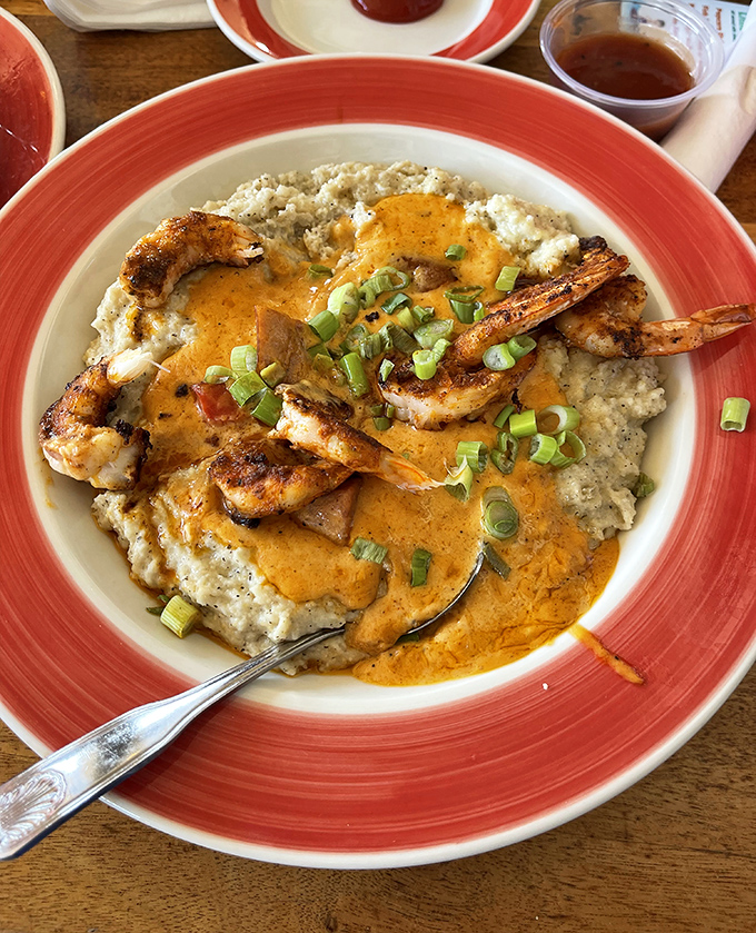 The legendary shrimp and grits—where Cajun-spiced Gulf shrimp perform a delicious ballet atop creamy, cheesy perfection.