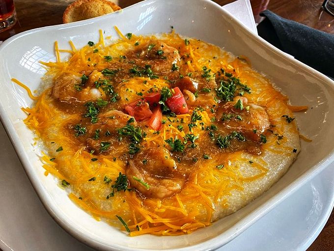 Behold the shrimp and grits that launched a thousand road trips – creamy, cheesy perfection worth every mile.