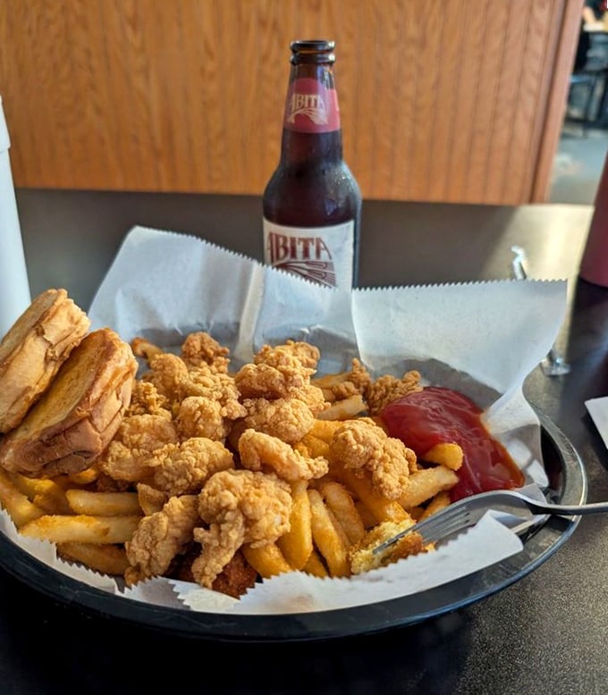Golden-fried shrimp that crunch like nature's perfect potato chip, paired with fries and an Abita – the Mississippi trinity of happiness.