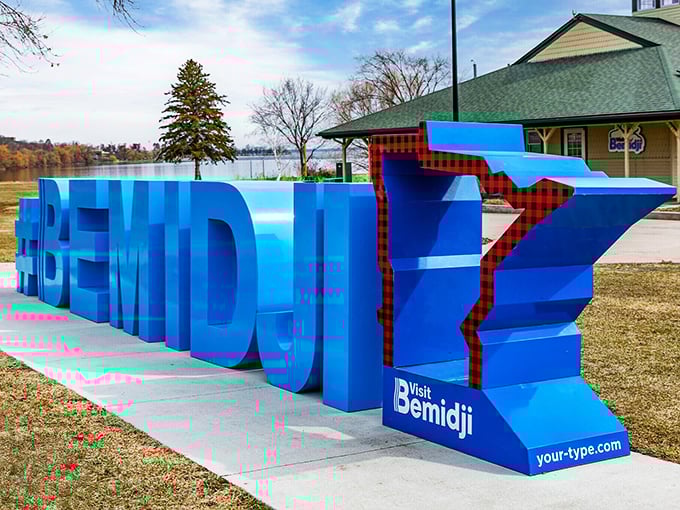 The "Visit Bemidji" sign combines Minnesota's outline with classic northwoods plaid—like if L.L. Bean designed state welcome signs.