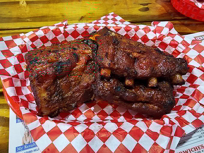 These ribs don't just fall off the bone—they practically leap into your mouth. The bark alone would make a vegetarian question their life choices.