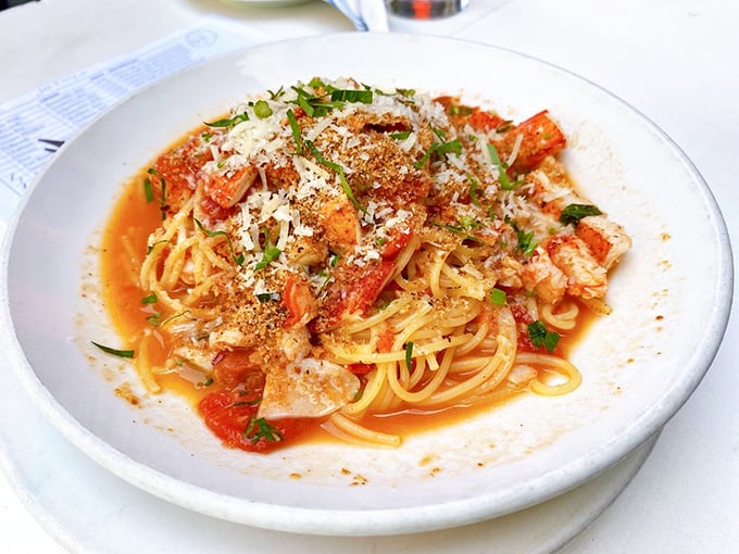 Thin strands of pasta swimming in buttery lobster glory—this is what carb-loading for a marathon should actually look like.
