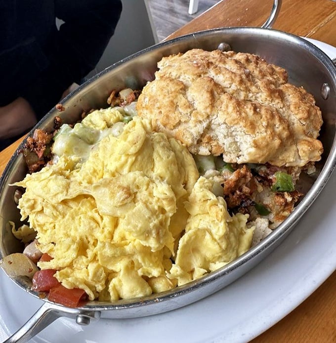 Behold the skillet in all its glory—where fluffy eggs meet savory fillings in a cast-iron masterpiece that puts ordinary breakfasts to shame. 
