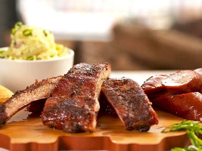 These ribs don't just fall off the bone—they practically leap into your mouth with a perfect bark that would make tree surgeons jealous.