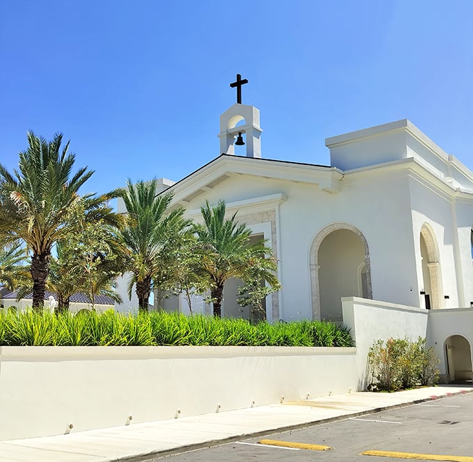 St. Agnes Catholic Church offers spiritual sanctuary with a side of tropical paradise – because even prayers sound better with palm trees.