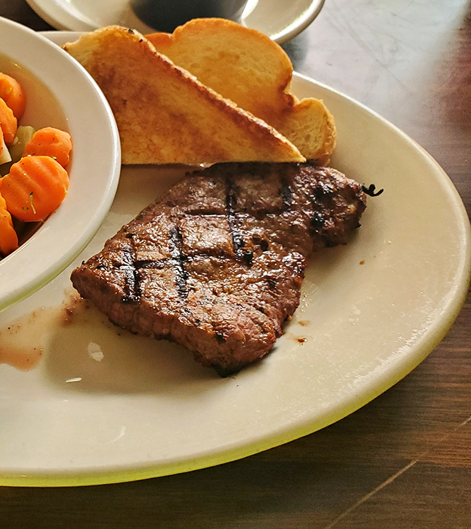 When your steak arrives with that perfect char and pink center, you'll understand why people drive hours for this.