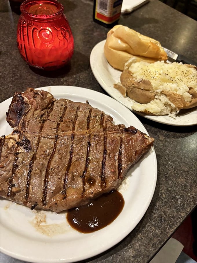 This T-bone doesn't need filters or fancy plating—just a white plate, a puddle of jus, and a baked potato standing by like a faithful sidekick.