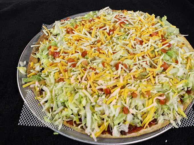 Behold the legendary Taco Pizza in all its glory – a harmonious marriage of Italian foundation and Mexican inspiration that will haunt your dreams.
