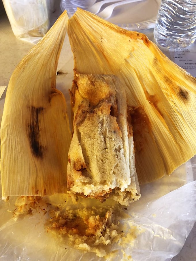 Unwrapping a tamale is like opening a present where the wrapping is almost as important as what's inside—the corn husk imparts subtle flavor to the masa.
